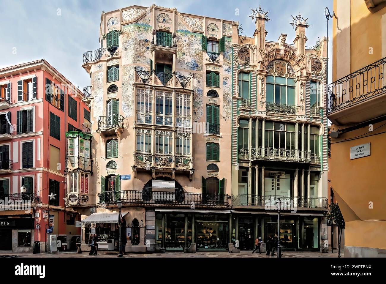 Colorful Art Nouveau buildings with ornate facades lining a European ...