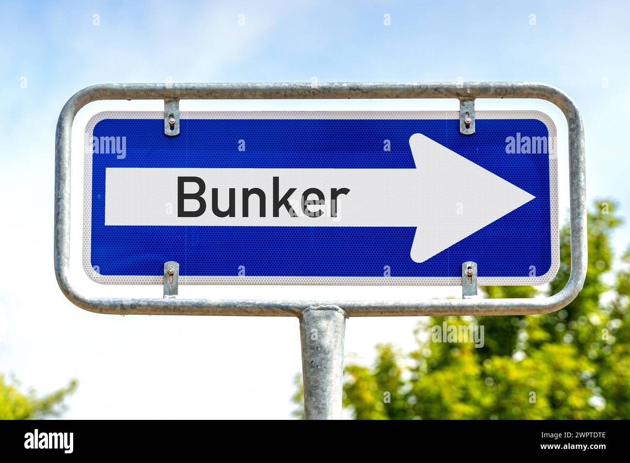 9 March 2024: Signpost with inscription: Bunker. PHOTOMONTAGE ...