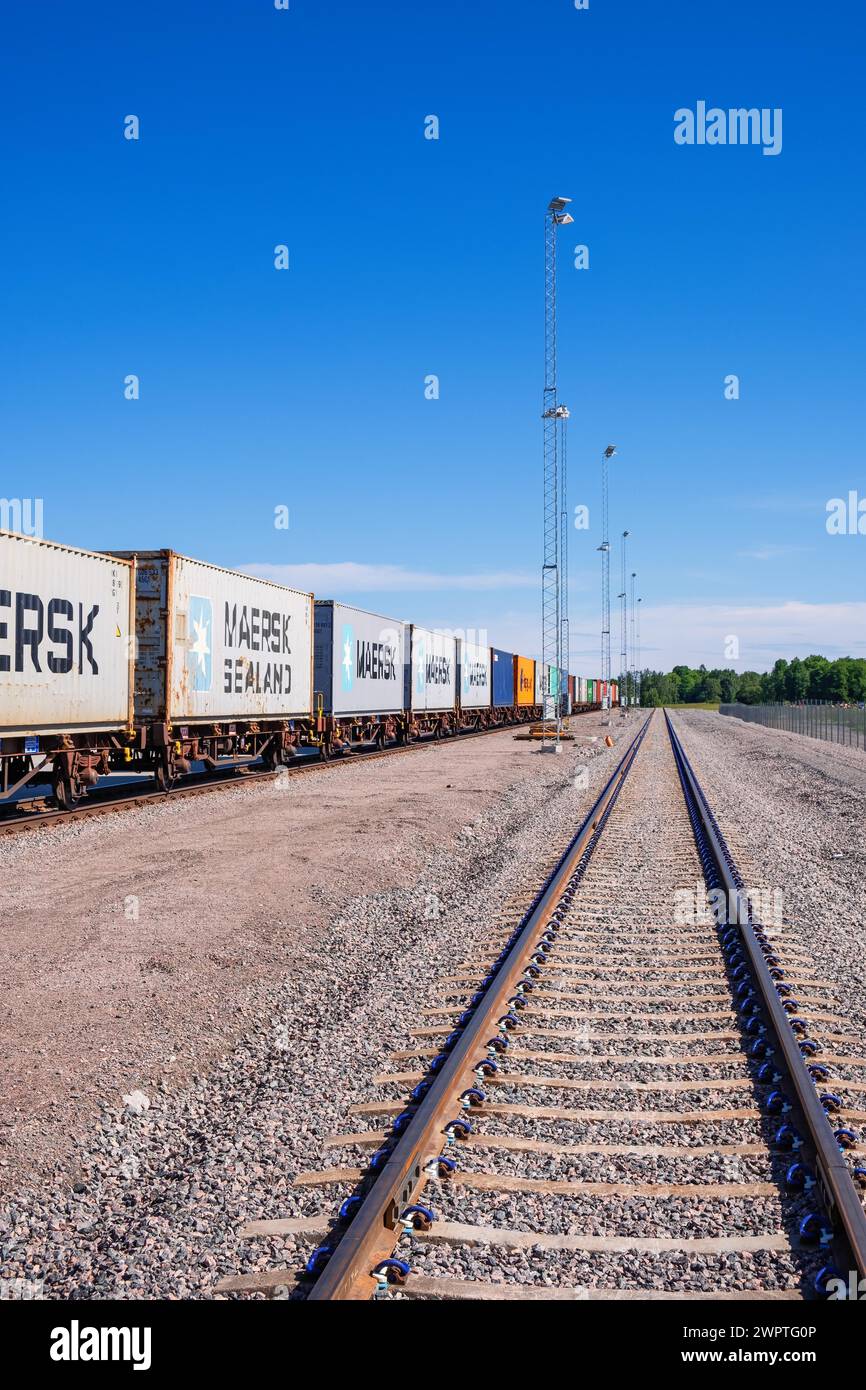 Railway tracks with train wagons with containers in a railway yard ...