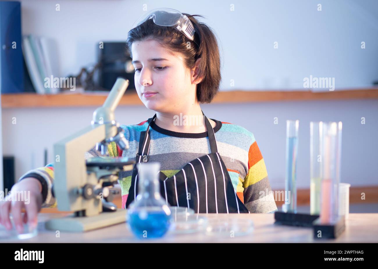Modern educational program including practical classes. A young chemist ...