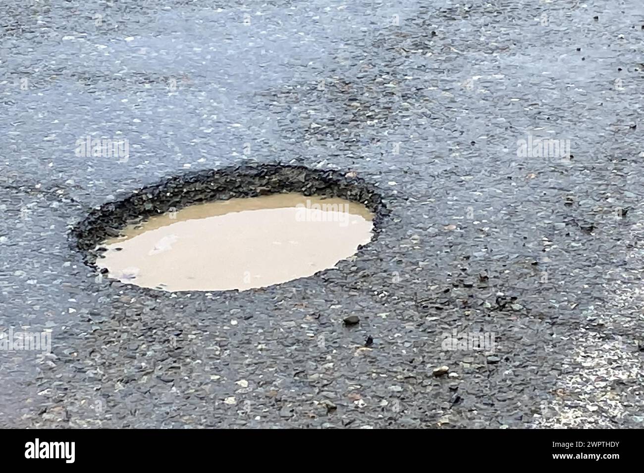 Large pothole in an asphalt road, Alaska Highway, Yukon Territory ...
