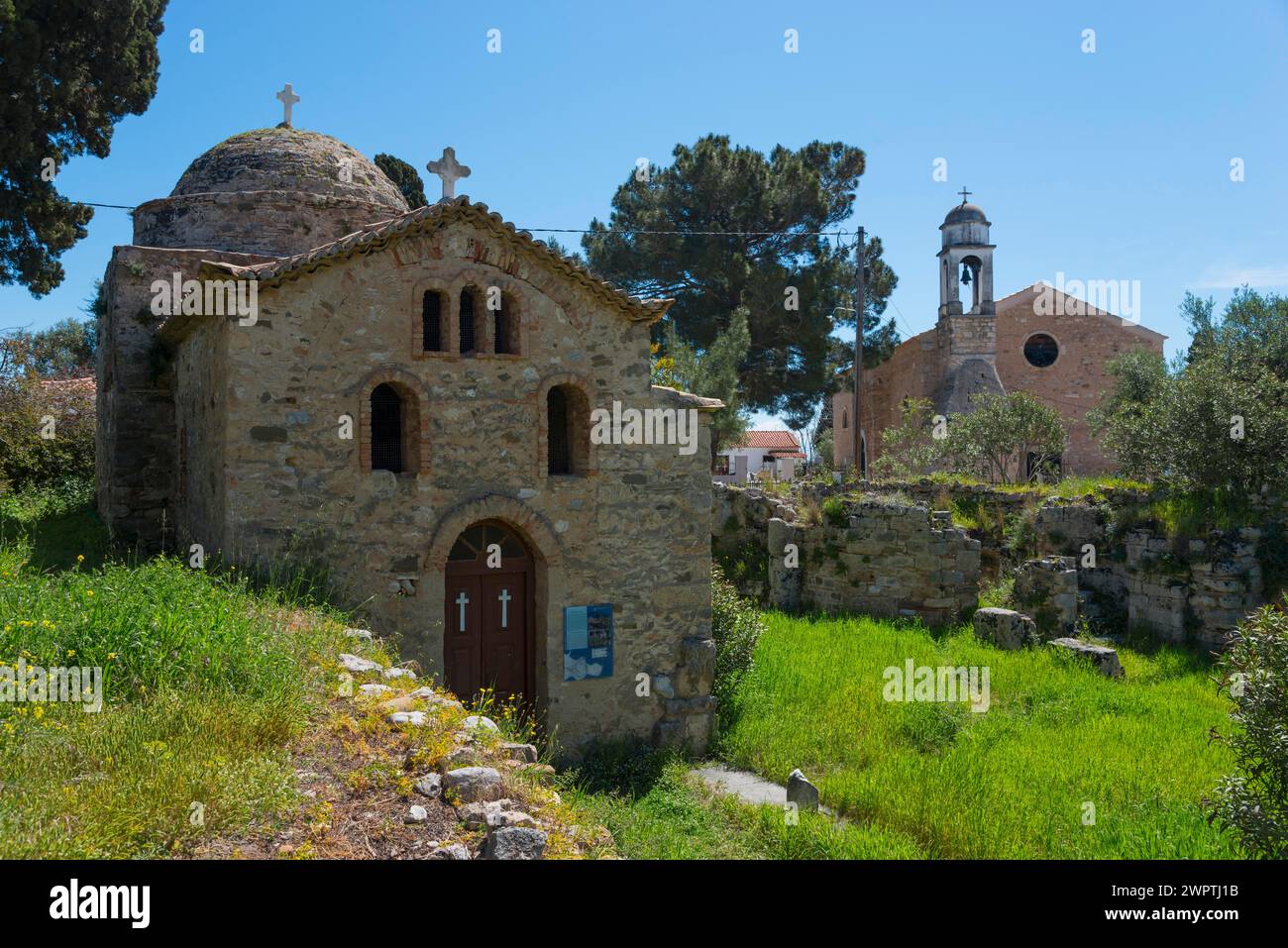 Ancient stone church surrounded by trees and vegetation, Temple of ...