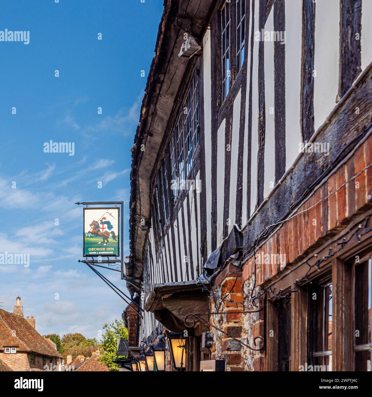 The black and white half timbered George Inn and pub sign in High ...