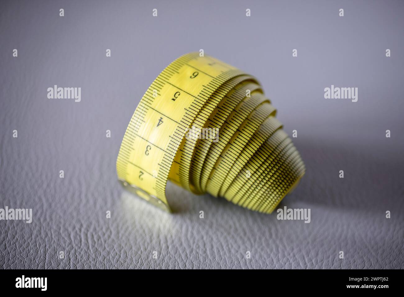 Yellow tape measure, roll Stock Photo - Alamy