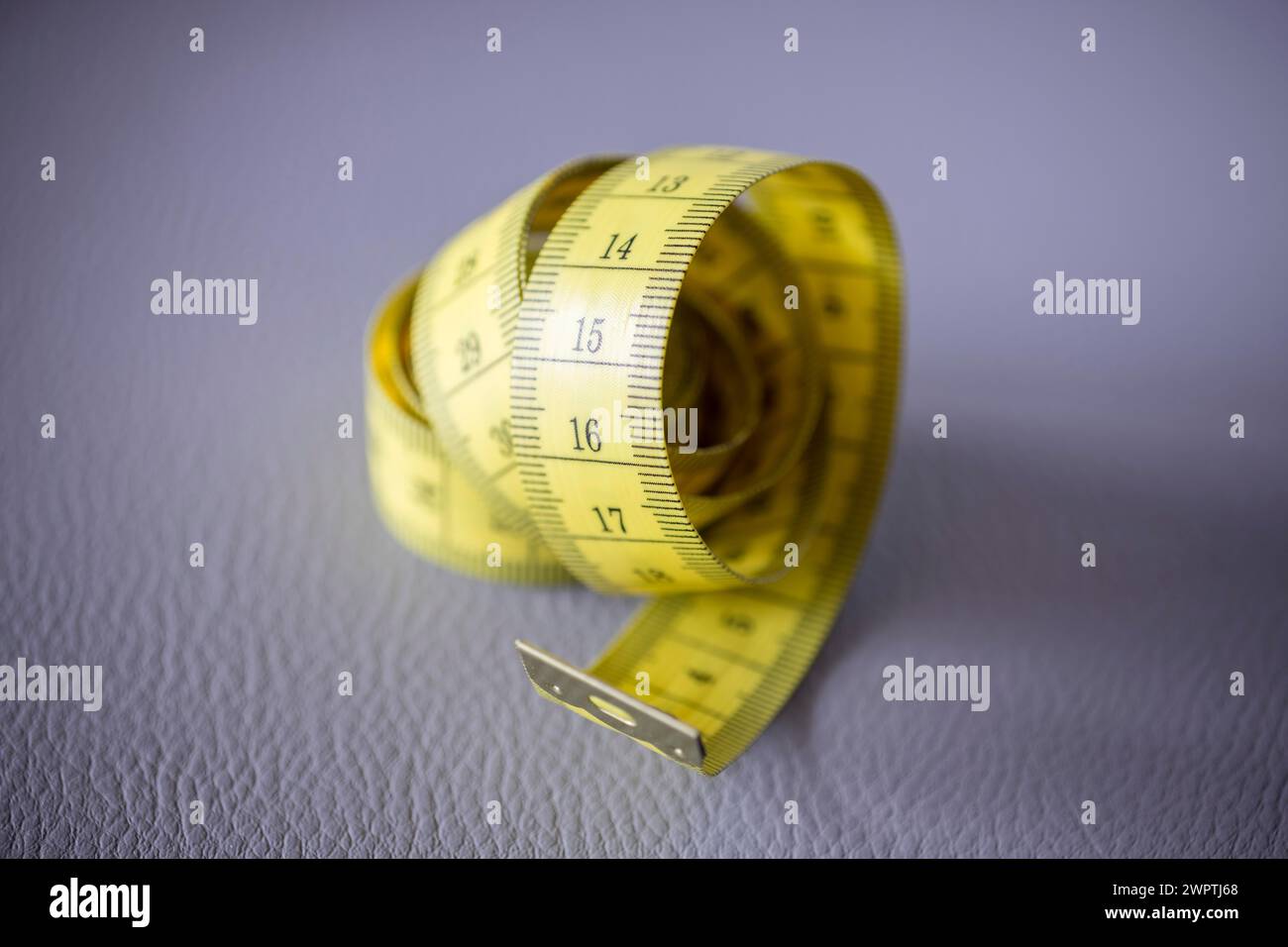 Yellow tape measure, roll Stock Photo - Alamy