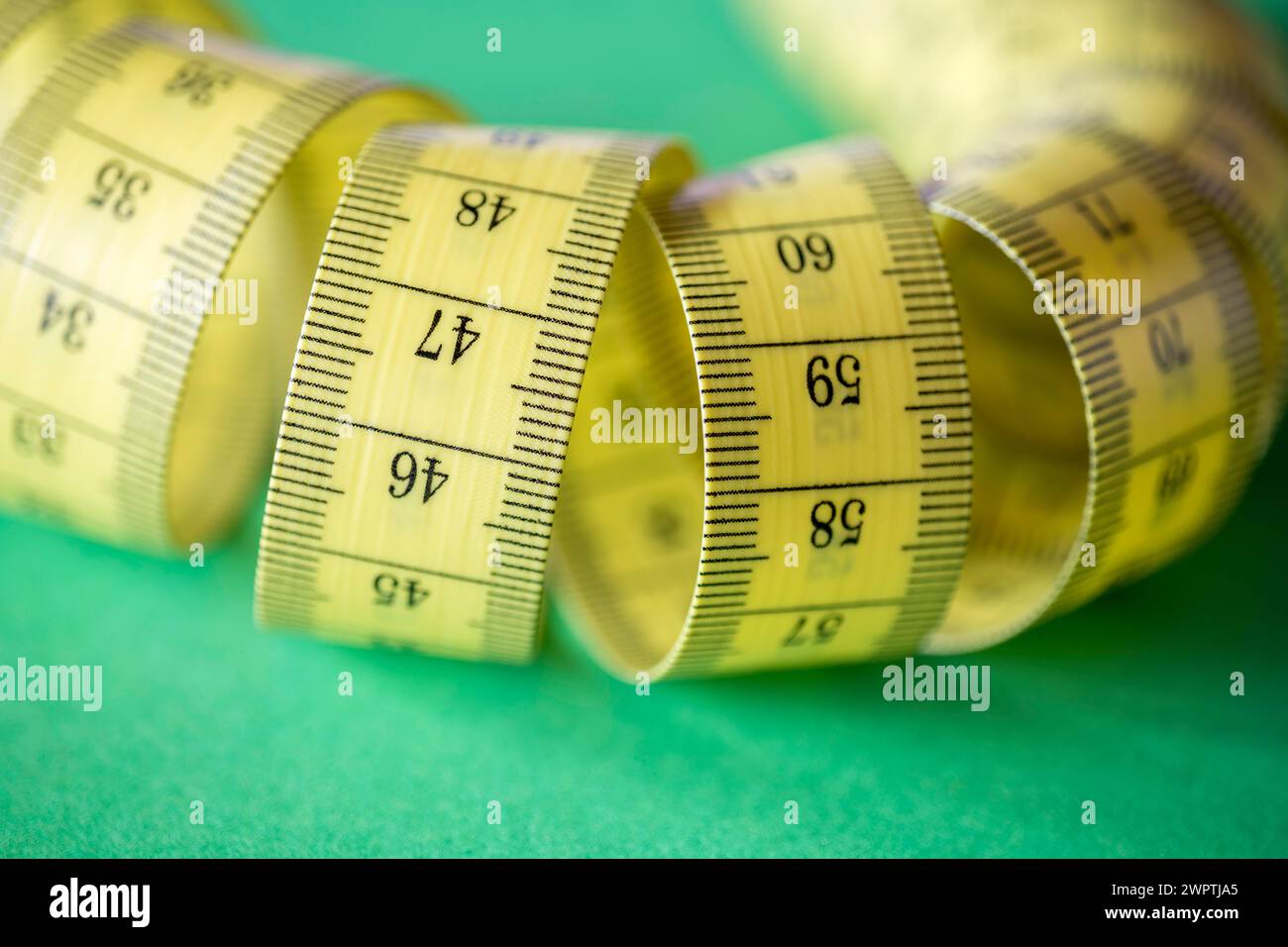 Yellow tape measure Stock Photo - Alamy