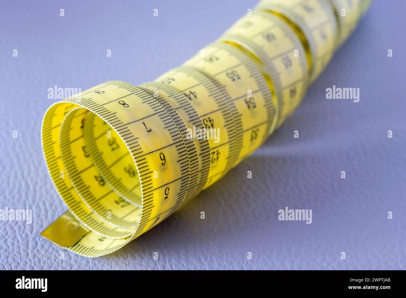 Yellow tape measure Stock Photo - Alamy
