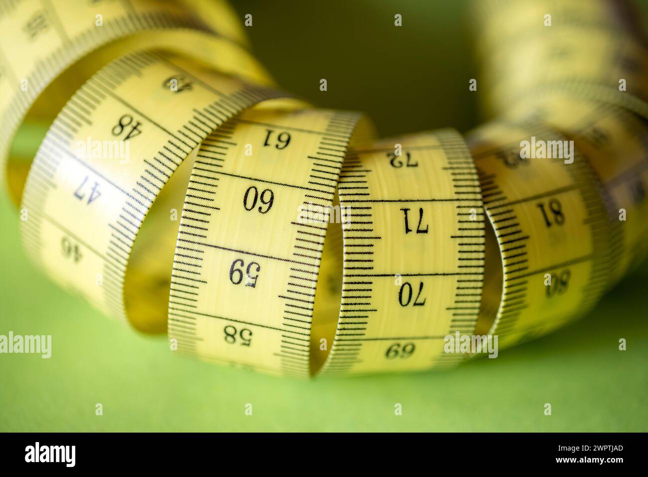 Yellow tape measure Stock Photo - Alamy