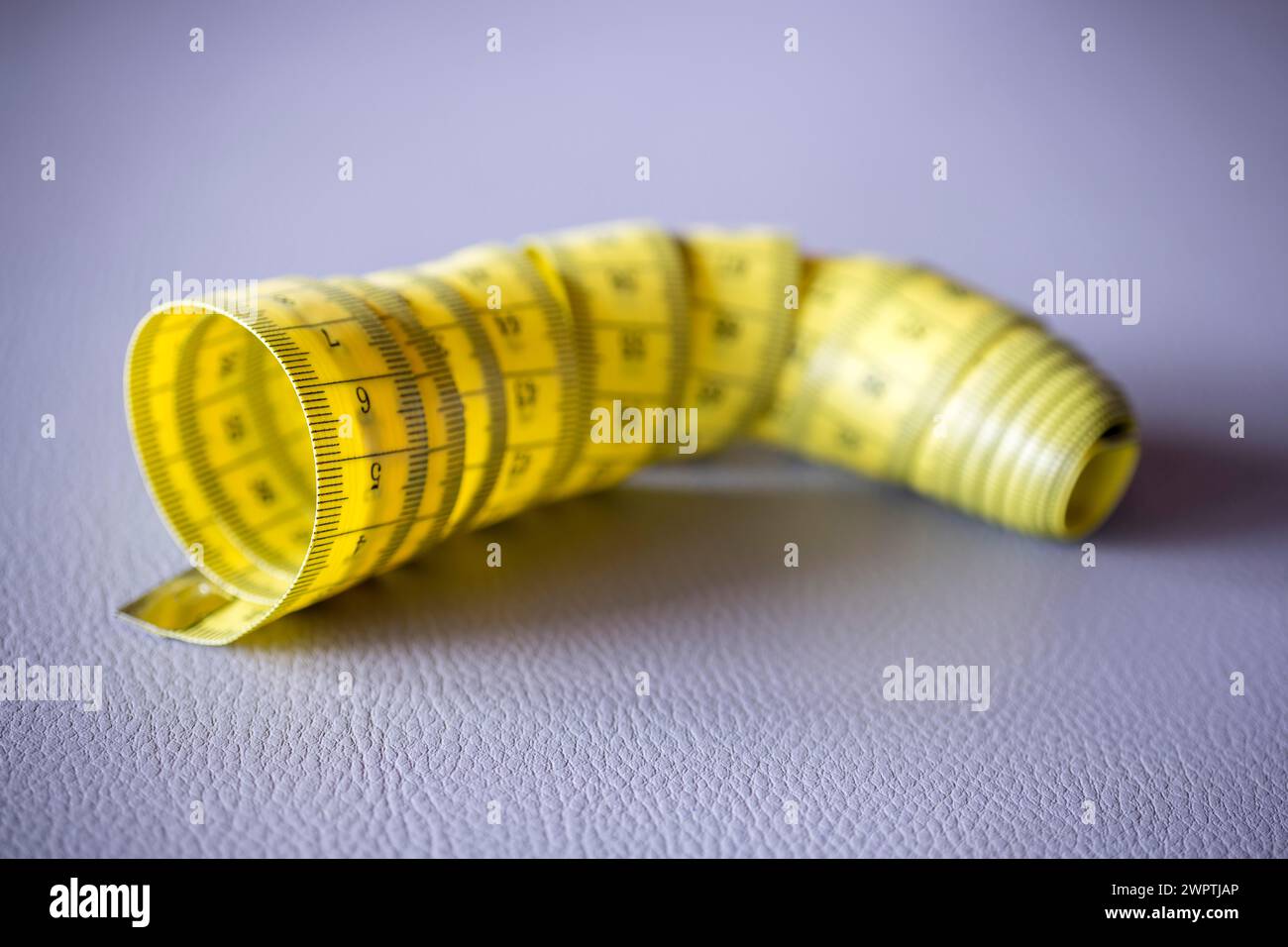 Yellow tape measure Stock Photo - Alamy