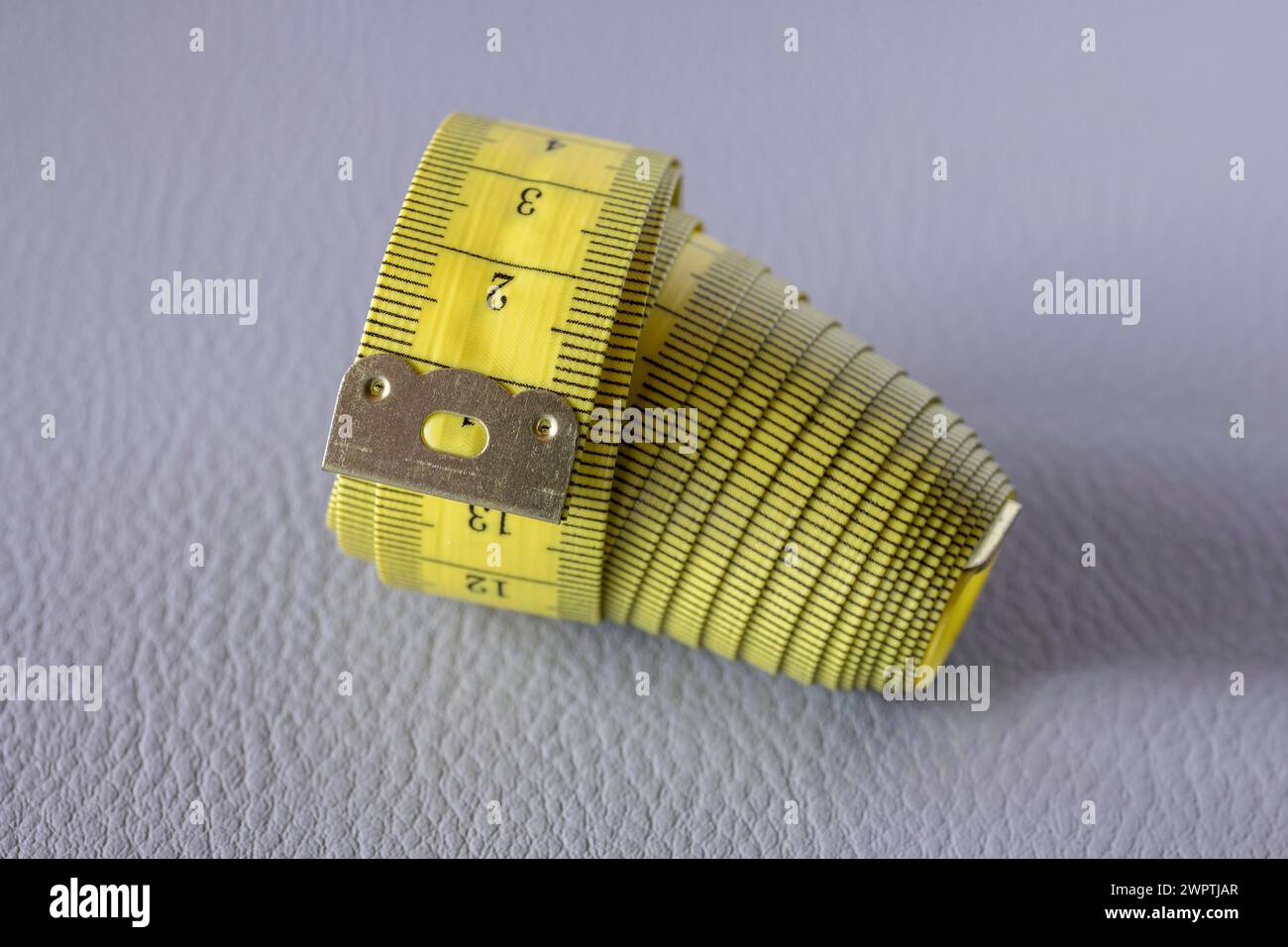 Yellow tape measure, roll Stock Photo - Alamy