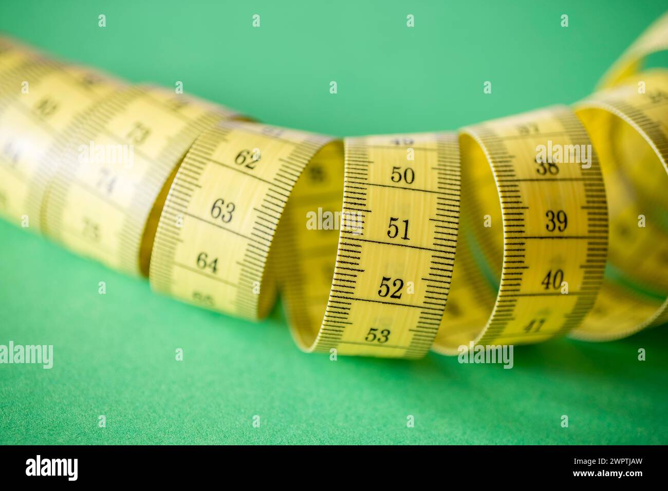 Yellow tape measure Stock Photo - Alamy
