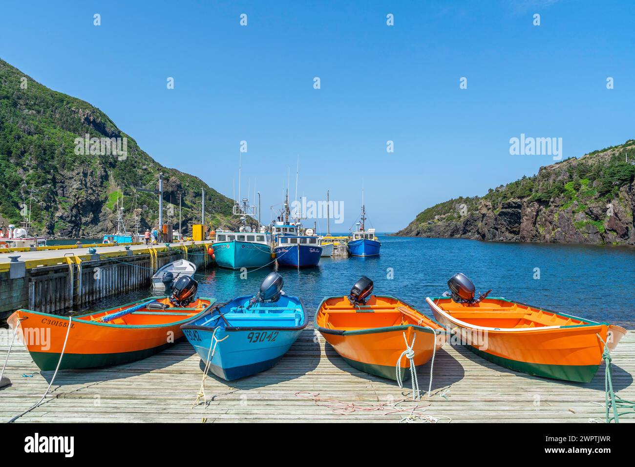 Colourful motorboats and fishing boats in the harbour of the fishing ...