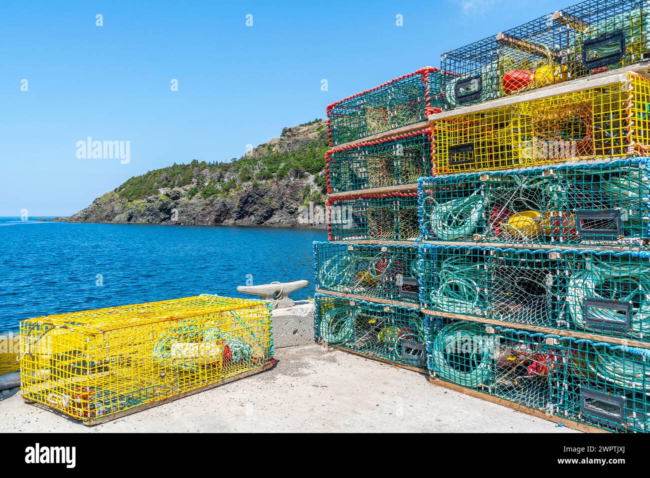 Stack of lobster pots in the harbour of the fishing village of Lark ...