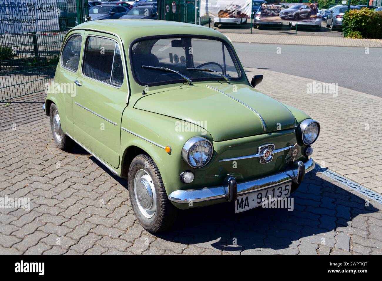 Front view of a green vintage Fiat parked on a cobbled street, Seat 600 ...