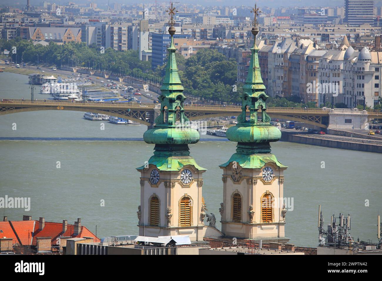 Traditional church towers and tourist Danube river, Budapest, Hungary ...