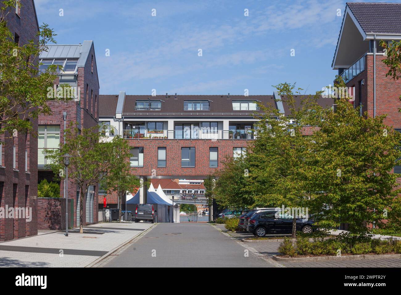 Modern brick residential building with residential street in the ...