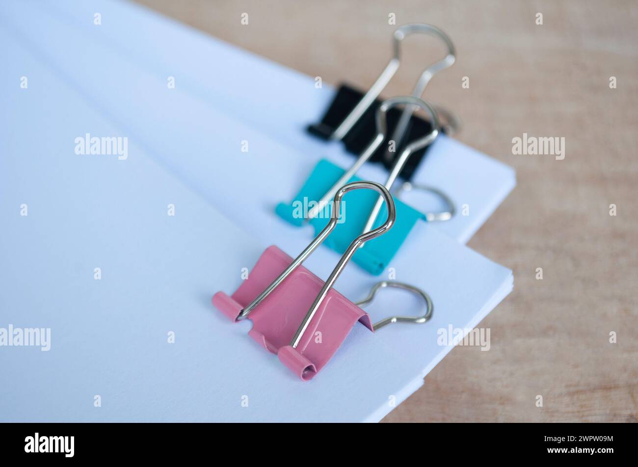 Blank document papers with paper clips pastel on wooden table. Document ...