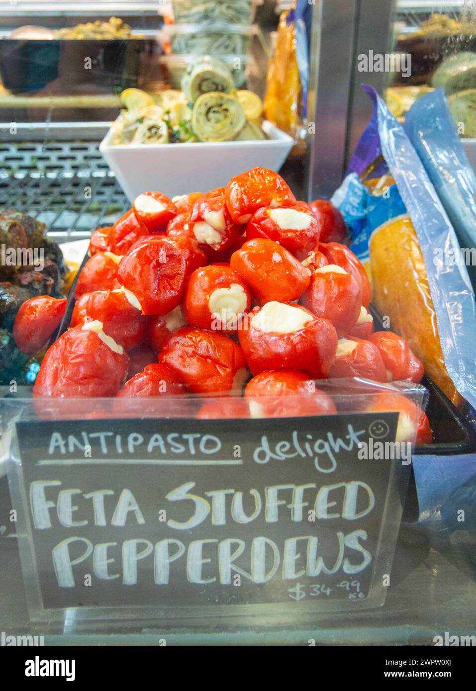 A market stall display of feta stuffed peppadews Stock Photo - Alamy