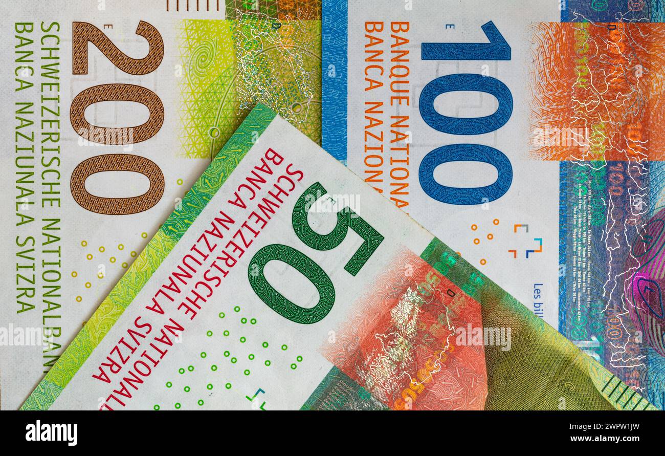 Closeup of 50, 100 and 200 Swiss franc banknotes for design purpose ...