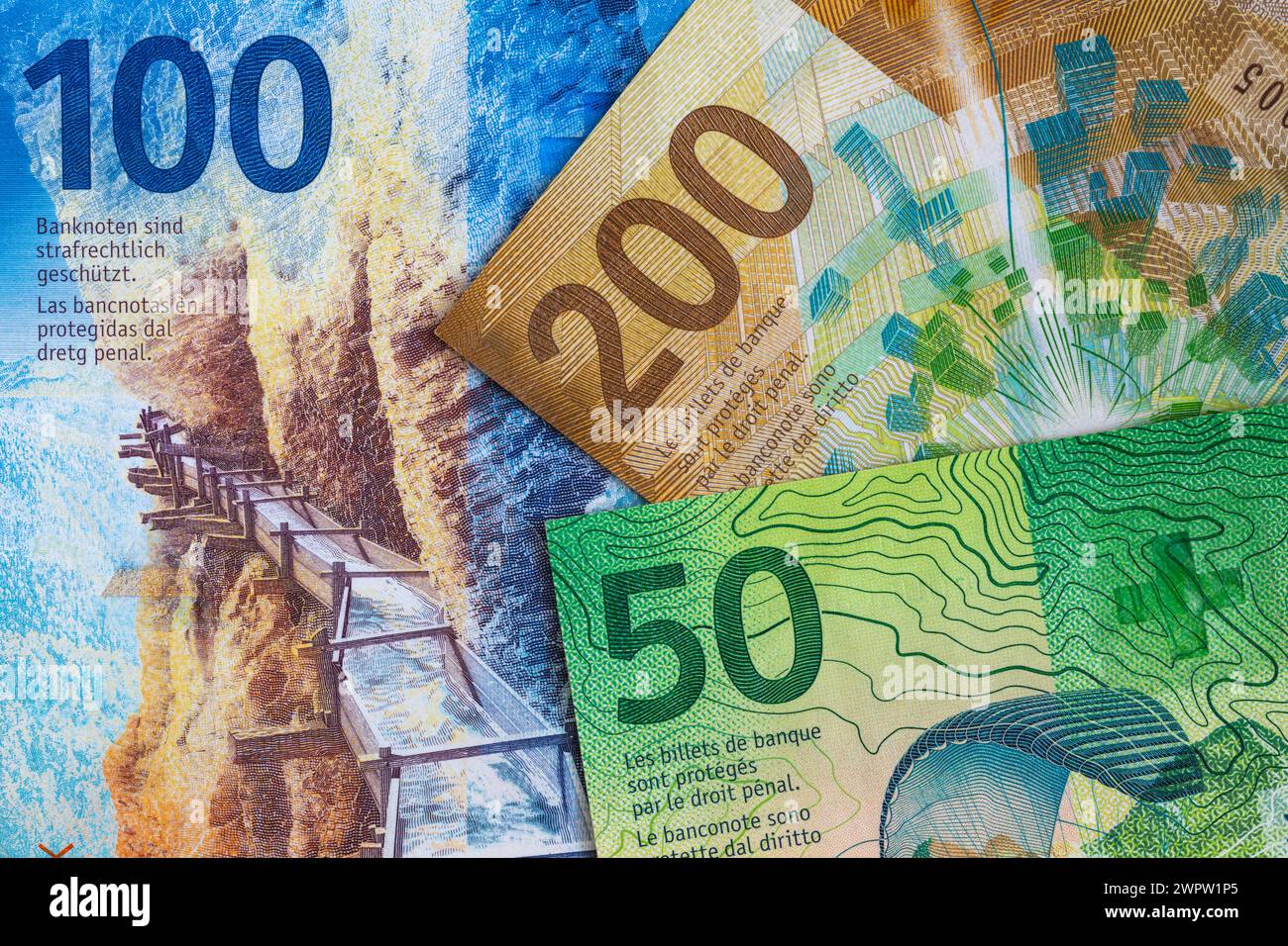 Closeup of 50, 100 and 200 Swiss franc banknotes for design purpose ...