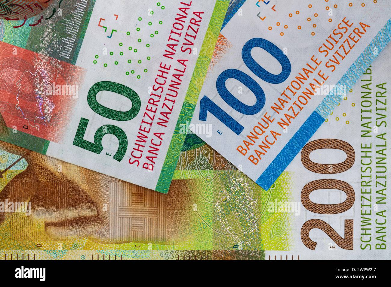 Closeup of 50, 100 and 200 Swiss franc banknotes for design purpose ...