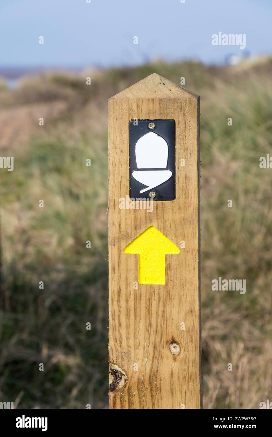 A National Trail waymarking sign behind the Norfolk coast Stock Photo ...