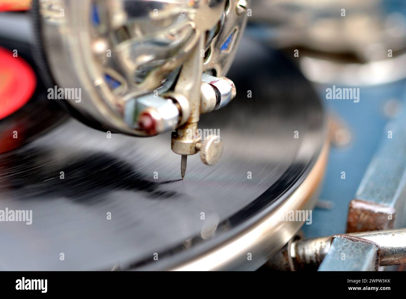 An old retro record playing on old vintage gramophone at flea market ...