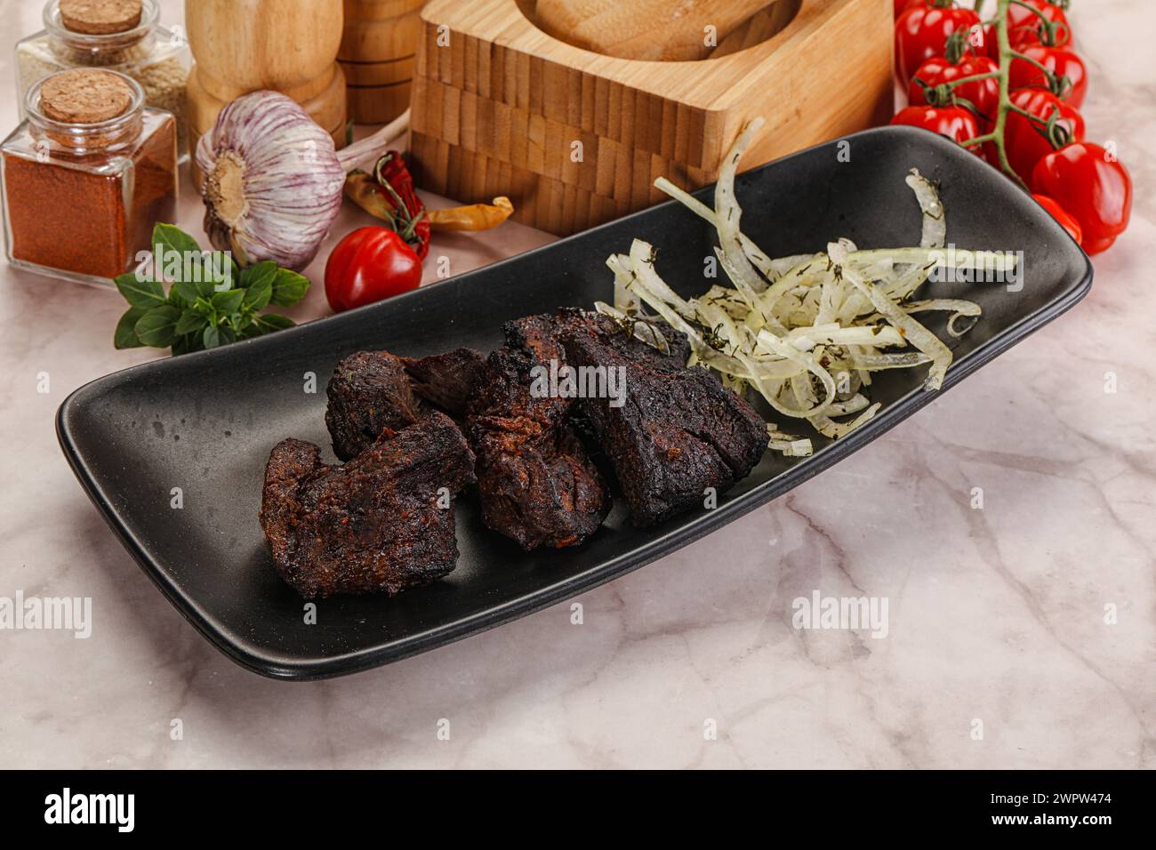 Grilled beef barbecue served onion rings Stock Photo - Alamy