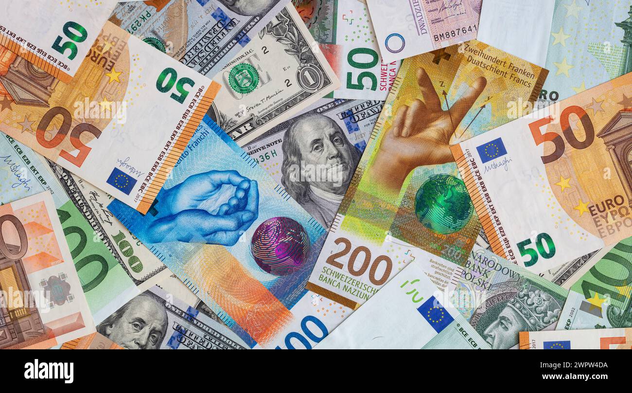 Closeup of Swiss franc, US dollar, Euro, polish zloty banknotes ...