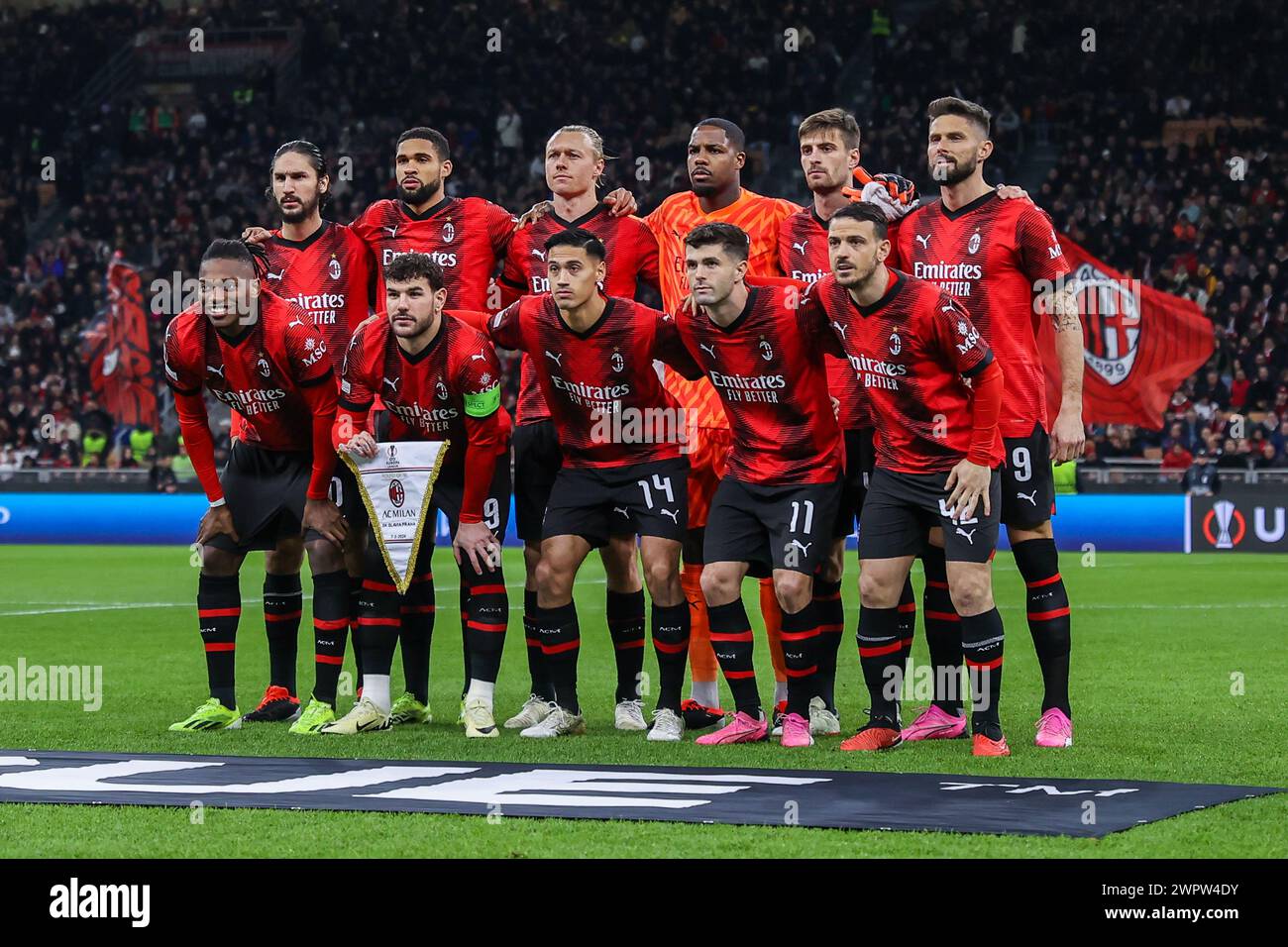 AC Milan team players pose for a group photo during Round of 16 . Leg 1 ...