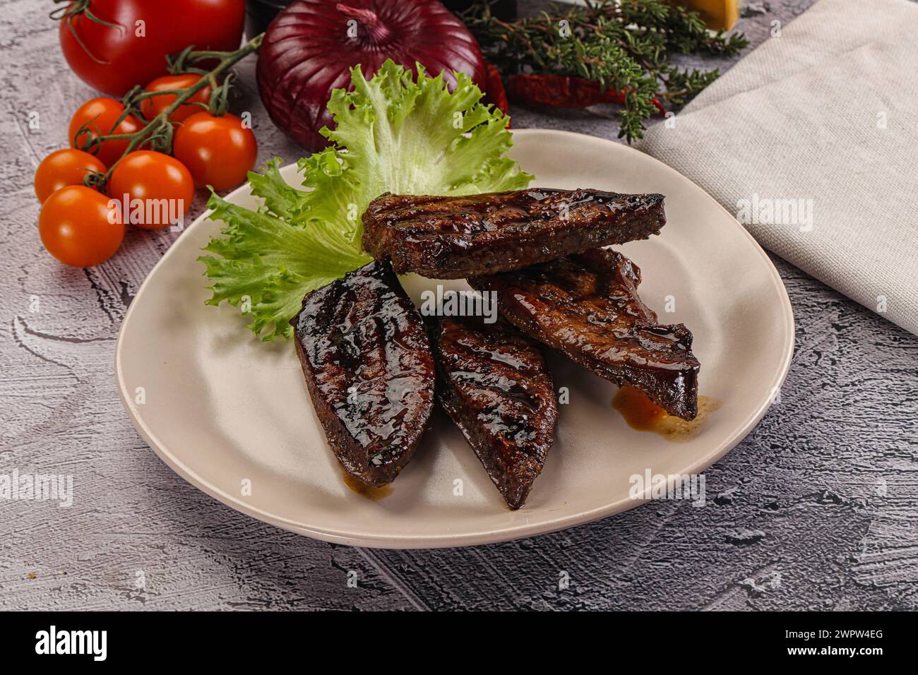 Grilled diet beef liver steak in the plate Stock Photo - Alamy