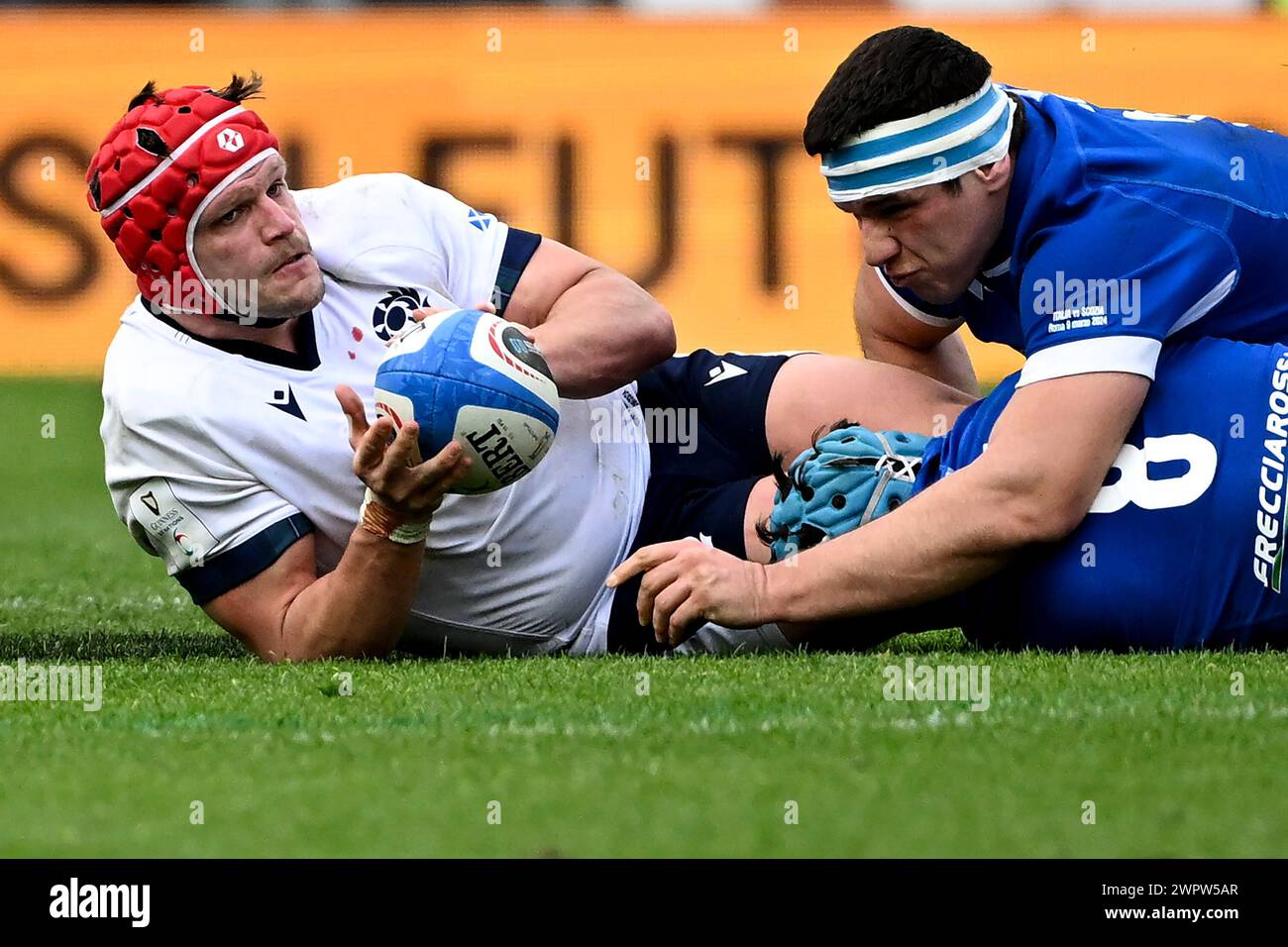 Rome, Italia. 09th Mar, 2024. George Turner of Scotland is tackled by ...