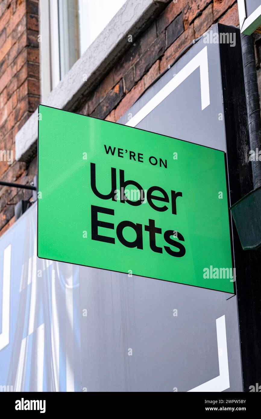 Uber Eats sign on outside wall Stock Photo - Alamy
