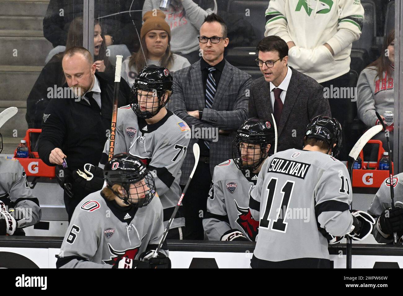 Omaha Mavericks head coach Mike Gabinet (right) addresses his players ...