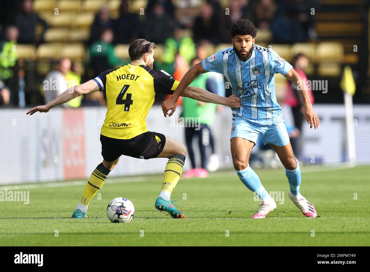 Coventry City's Ellis Simms (right) and Watford's Wesley Hoedt battle ...