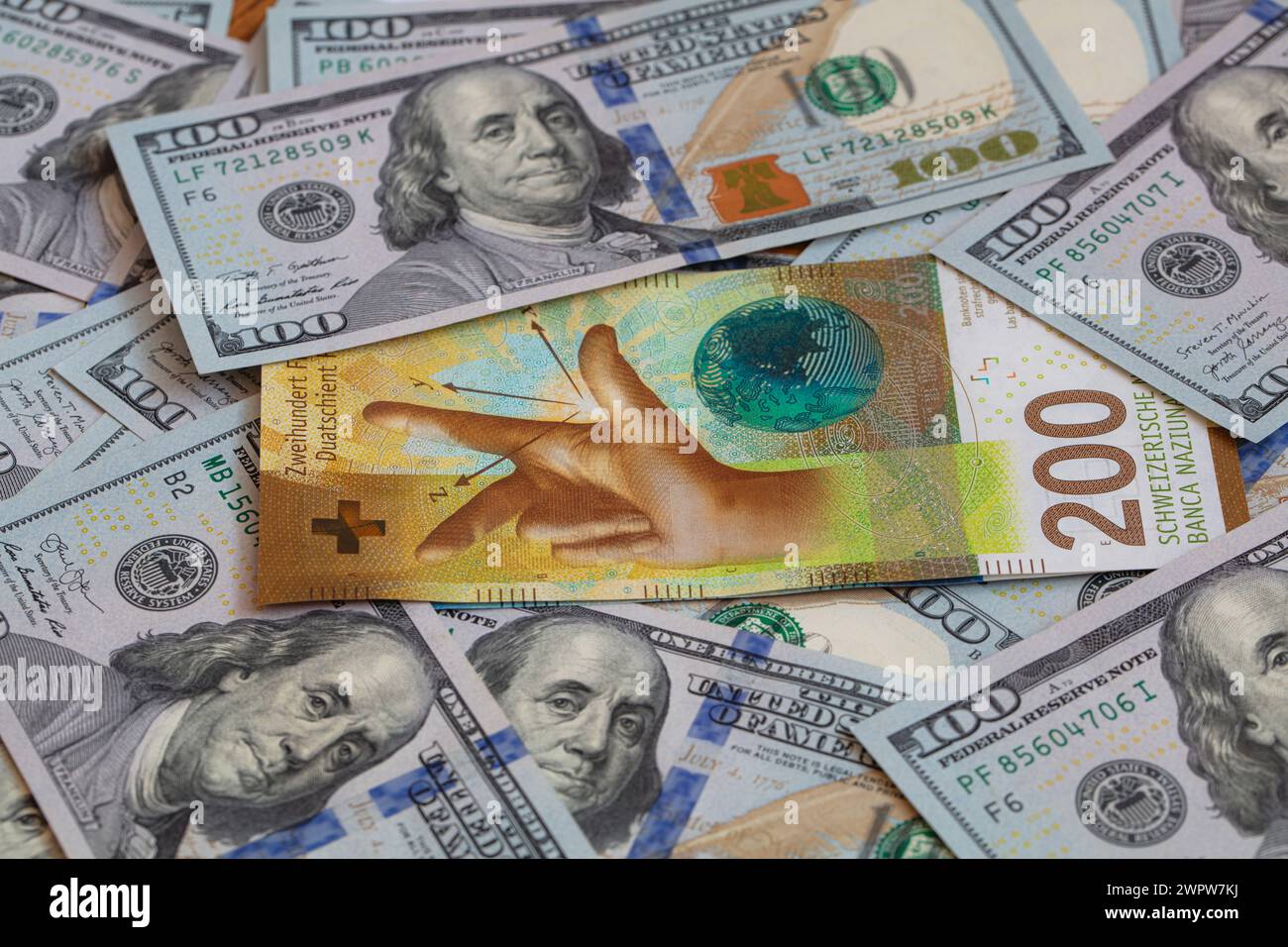 Closeup of 200 Swiss franc banknote and 100 dollar banknote for design purpose Stock Photo - Alamy