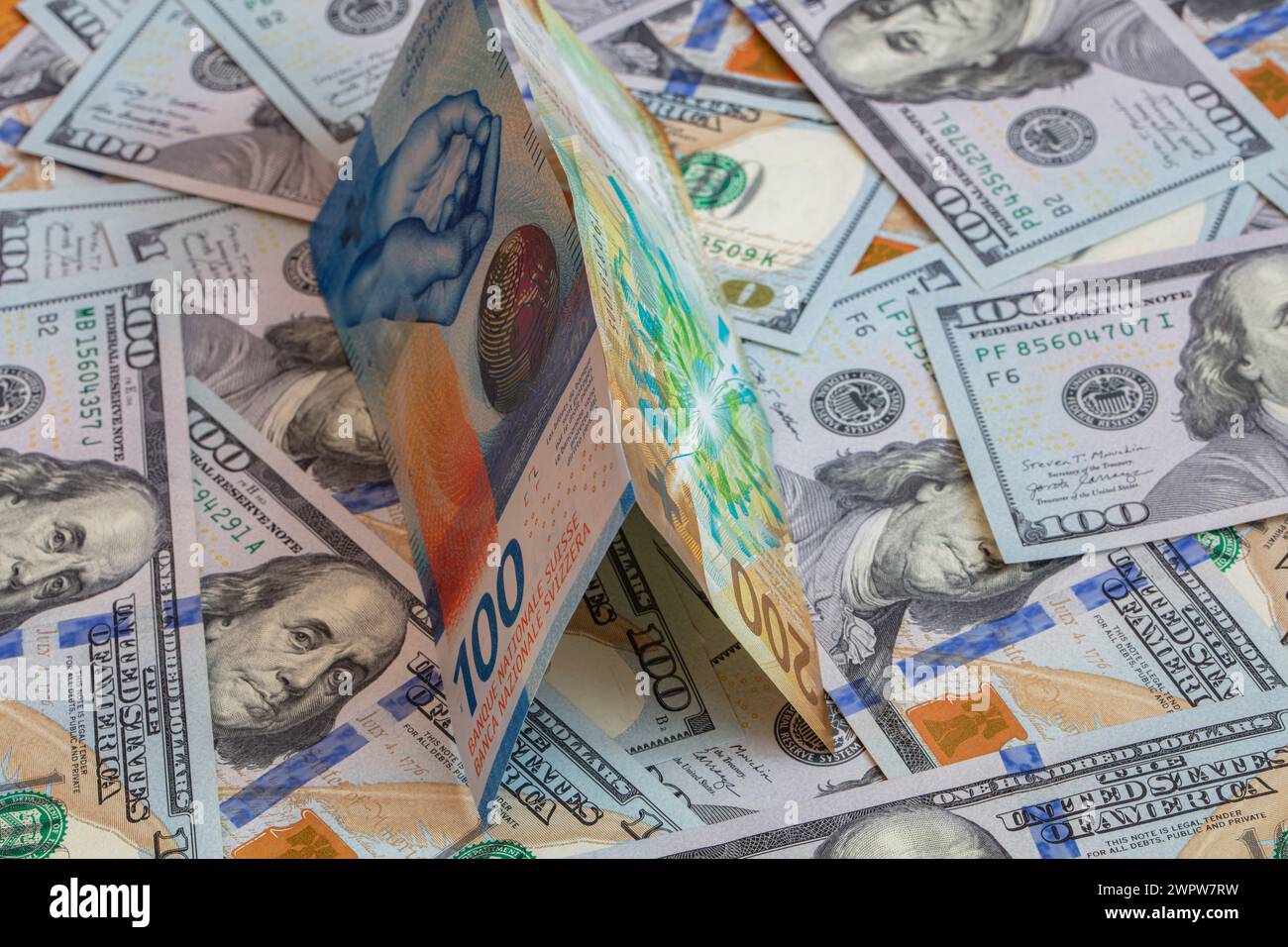 Closeup of 200 Swiss franc banknote and 100 dollar banknote for design purpose Stock Photo - Alamy