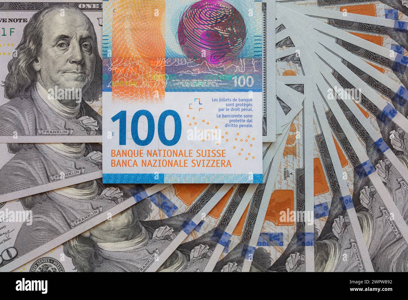 Closeup of 100 Swiss franc and 100 dollar banknotes for design purpose ...