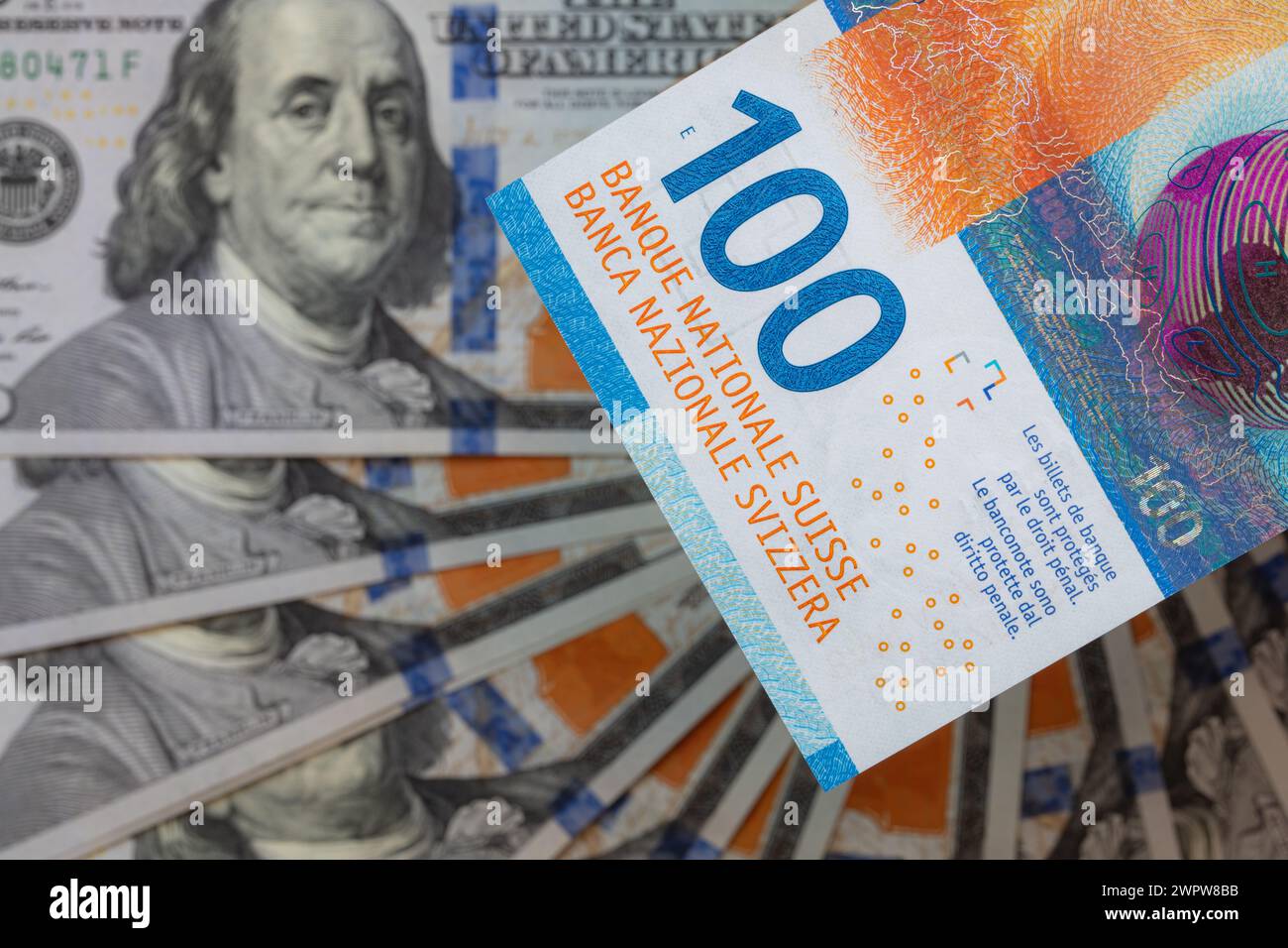Closeup of 100 Swiss franc and 100 dollar banknotes for design purpose ...