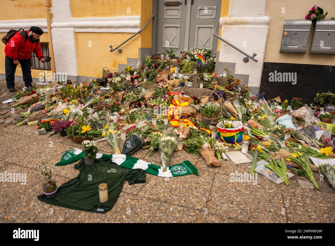 Flowers lie in front of Soren Pape Poulsen's former residence after the ...