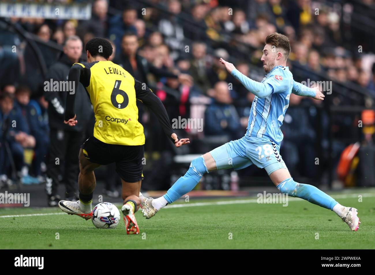 Coventry City's Josh Eccles (right) and Watford's Jamal Lewis battle ...