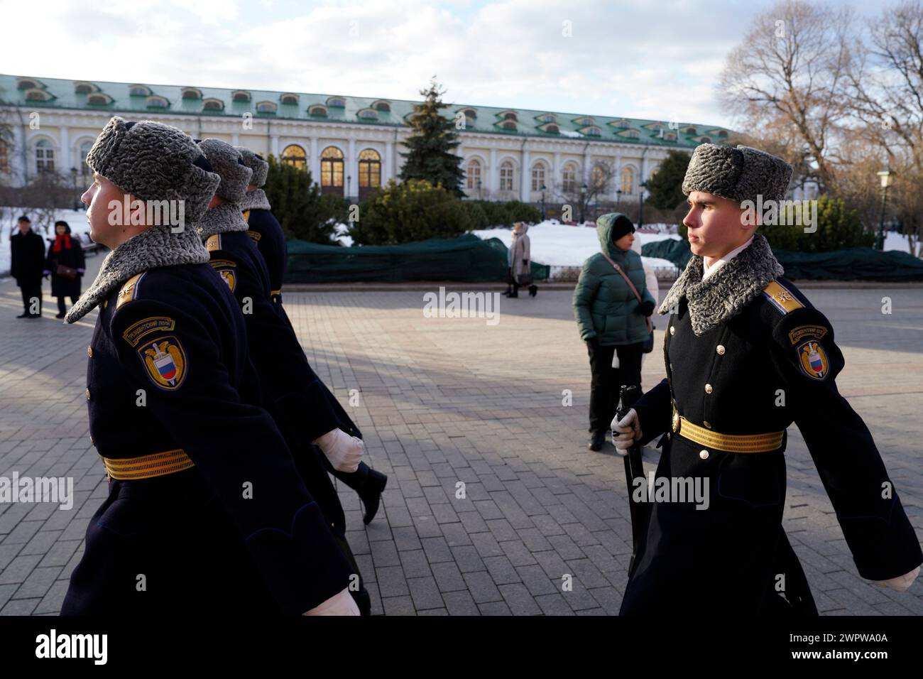 Members of the honor guard march during the changing ceremony at the ...