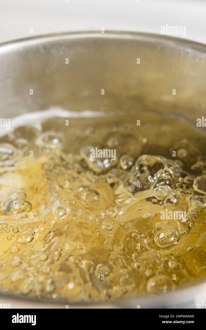 Woman adding water in pot hi-res stock photography and images - Alamy