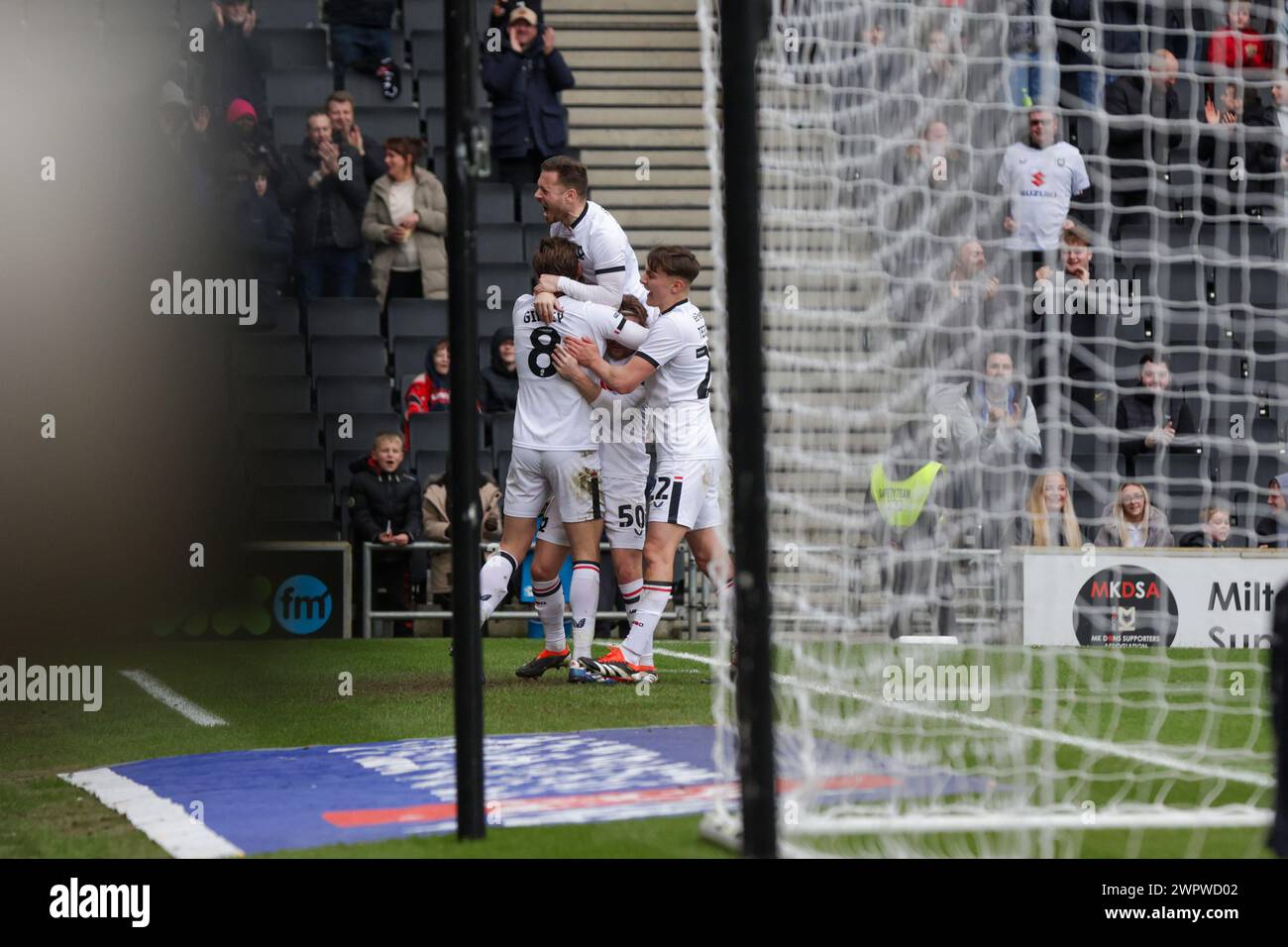 captain Alex Gilbey celebrates after scoring for Milton Keynes Dons, to ...