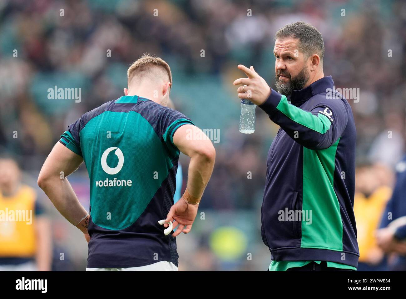 Andy Farrell head coach of Ireland speaks with Jack Crowley of Ireland before the 2024 Guinness ...