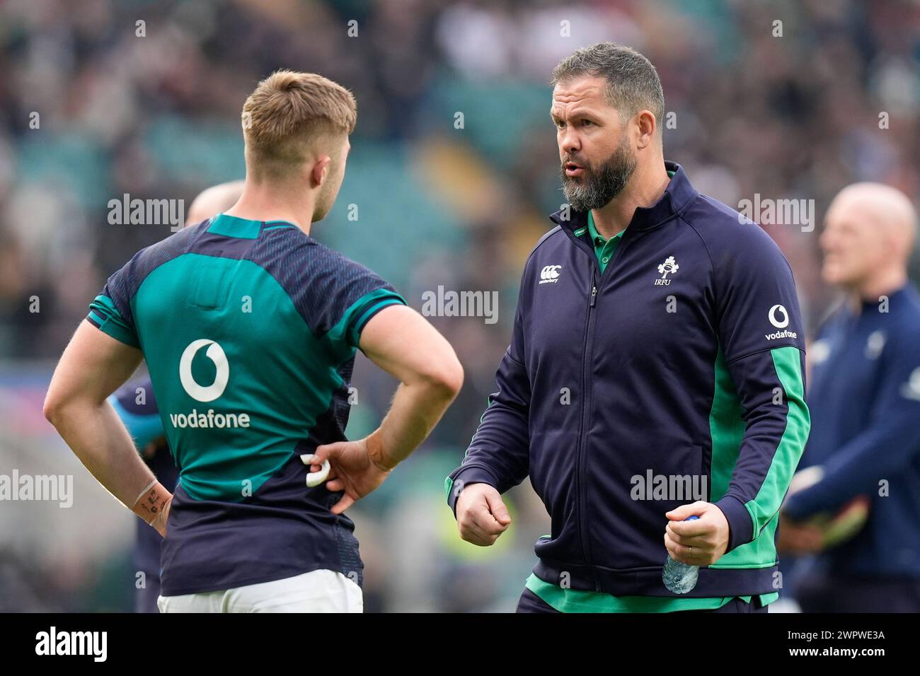 Andy Farrell head coach of Ireland speaks with Jack Crowley of Ireland before the 2024 Guinness ...