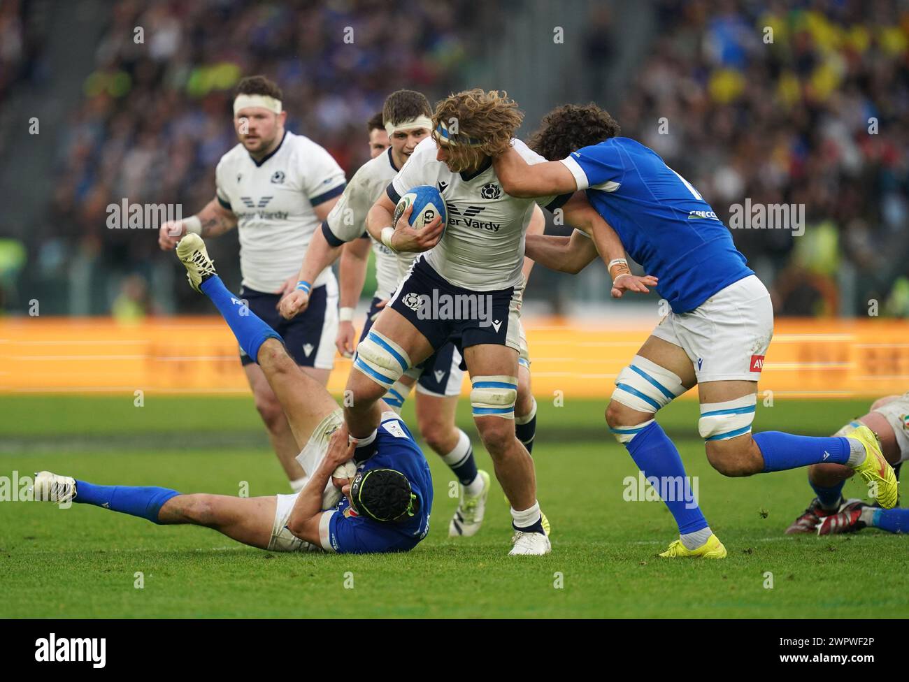 Scotland's James Ritchie is tackled by Italy's Juan Ignacio Brex (left ...