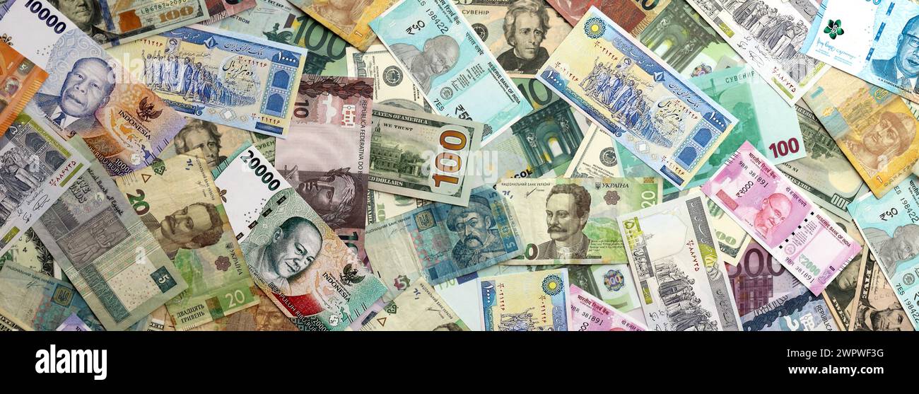 Many banknotes of different currency. Background of big amount of ...