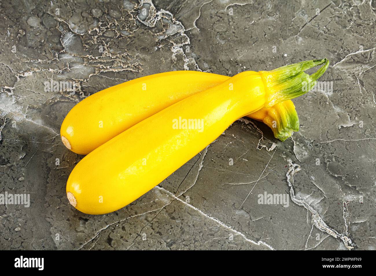 Two Yellow young zucchini for cooking Stock Photo - Alamy