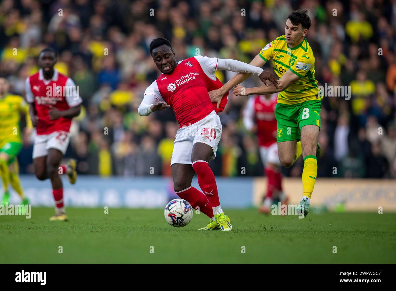 Arvin Appiah of Rotherham United on the ball with pressure from Liam ...